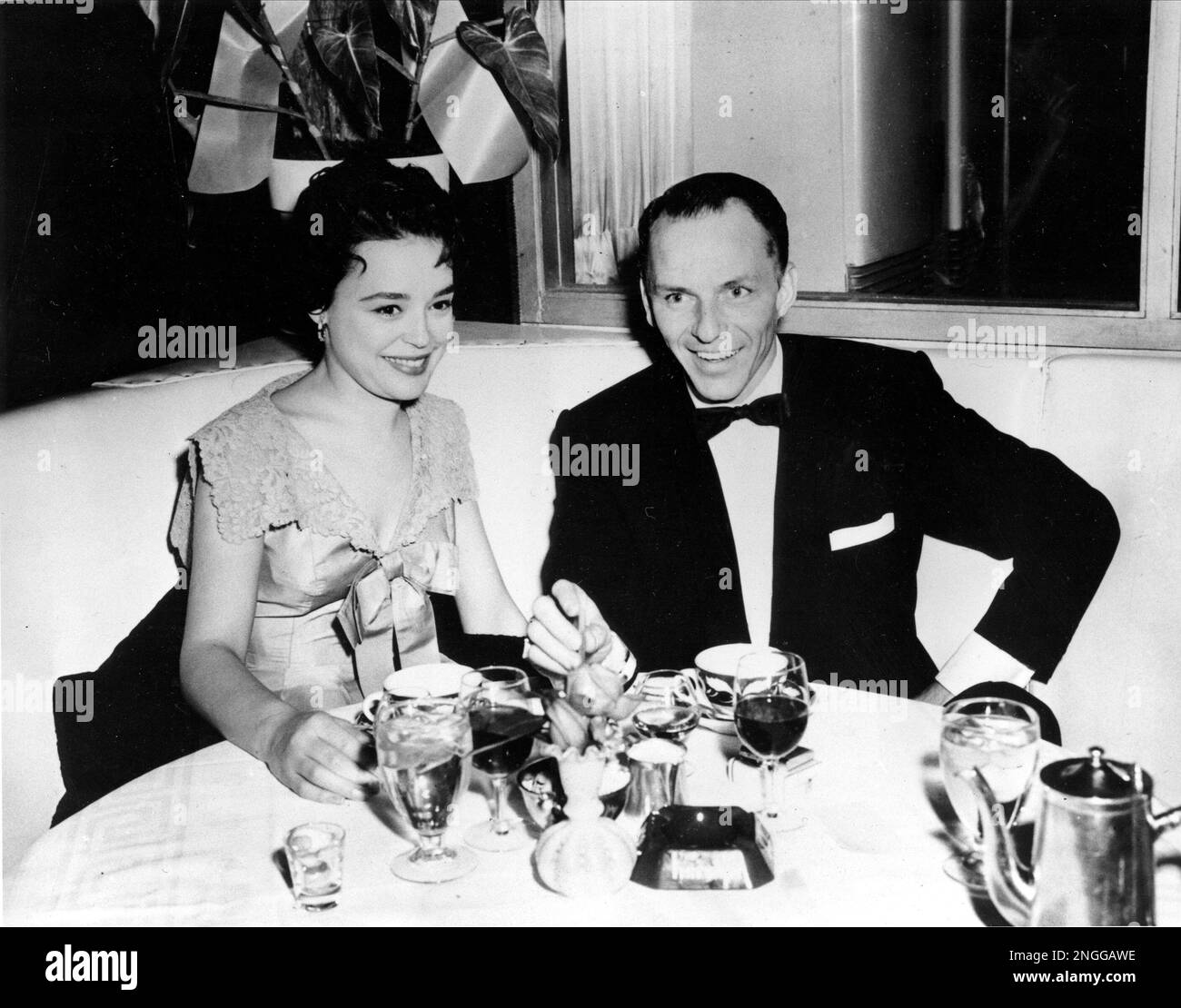 Singer and actor Frank Sinatra and recording artist Jill Corey dine at ...