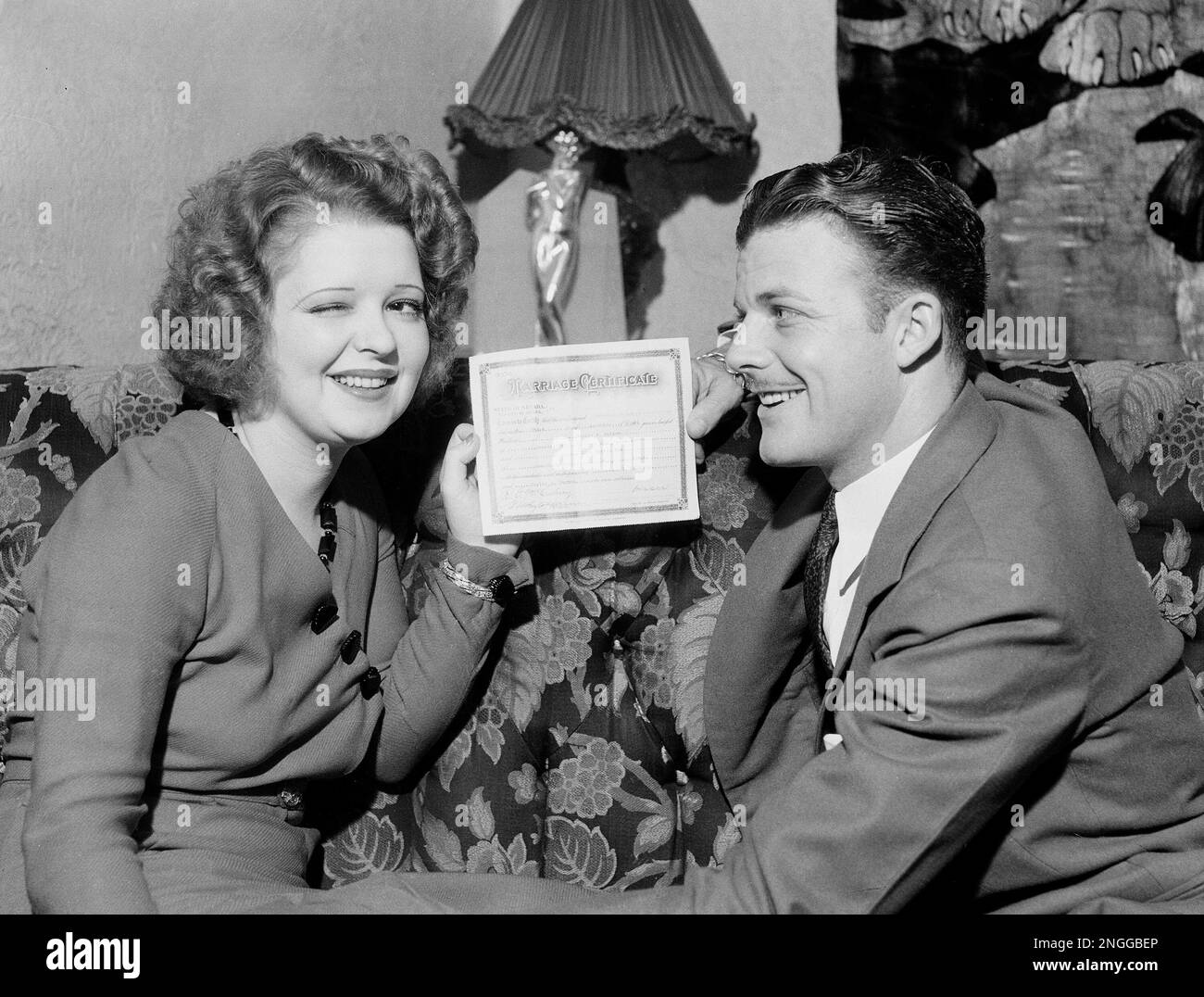Newlyweds Clara Bow, winking, and Rex Bell show their marriage ...