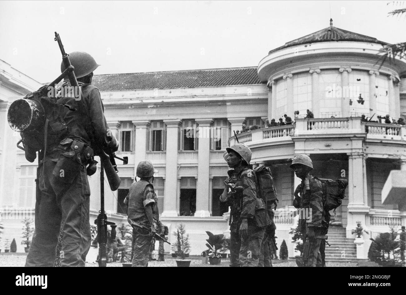 South Vietnamese rebel troops take up positions in the yard of the ...