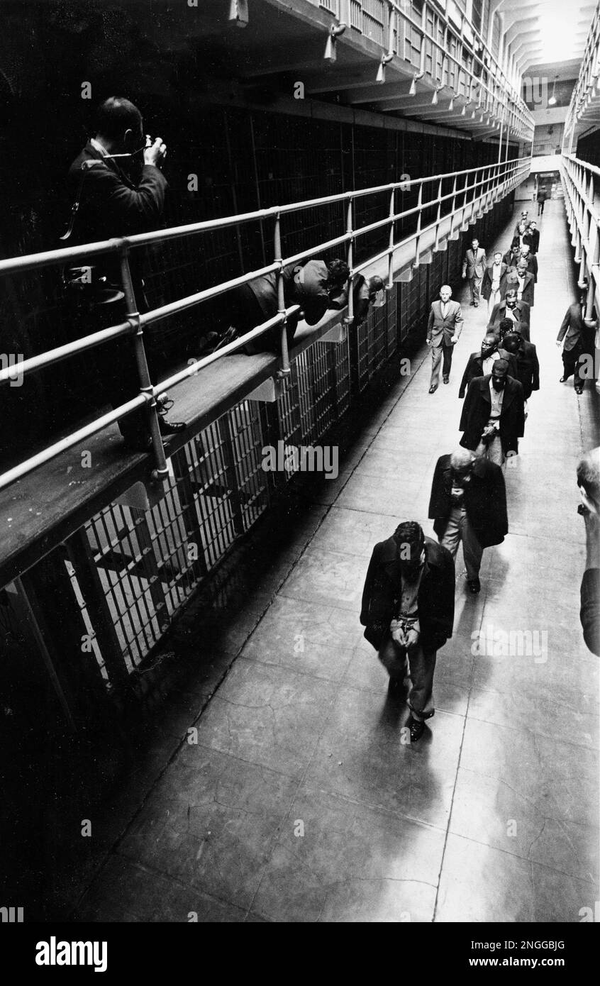 A line of handcuffed prisoners, the last of the convicts held at ...