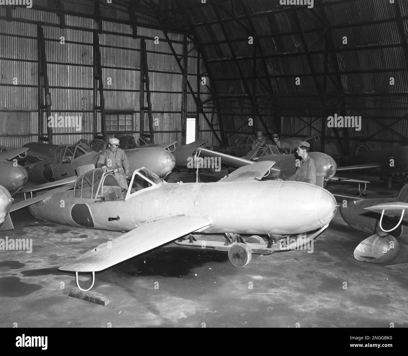 U.S. Marines from the 1st Regiment of the 4th Marine Division inspect a ...