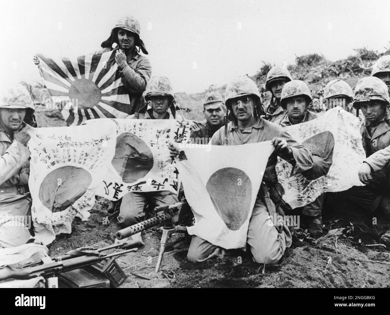 U.S. Marines of the 5th Division pose with captured Japanese battle ...