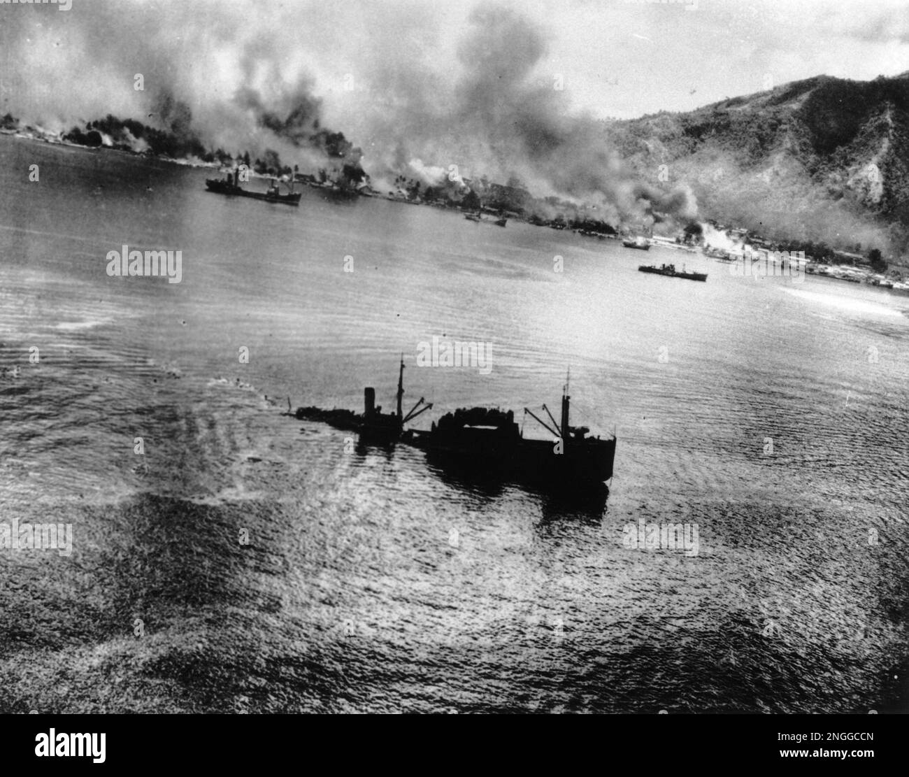 A Japanese ship sinks in Rabaul harbor, New Britain, on November 2 ...