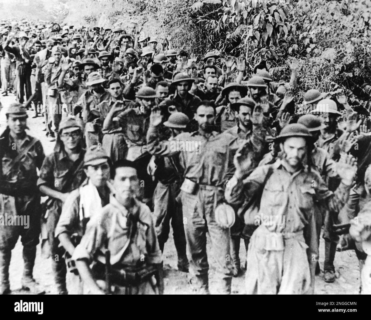 U.S. soldiers surrender to the Japanese forces at an unknown location ...