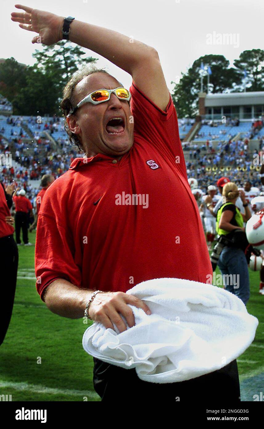 North Carolina State coach Chuck Amato celebrates as he leaves the ...