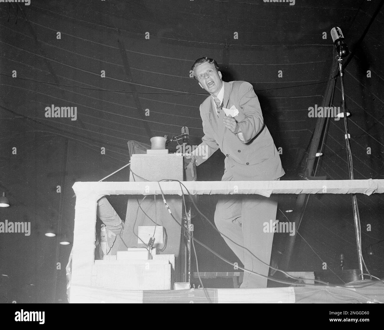Thirty-year-old evangelist Billy Graham gestures as he speaks to a ...