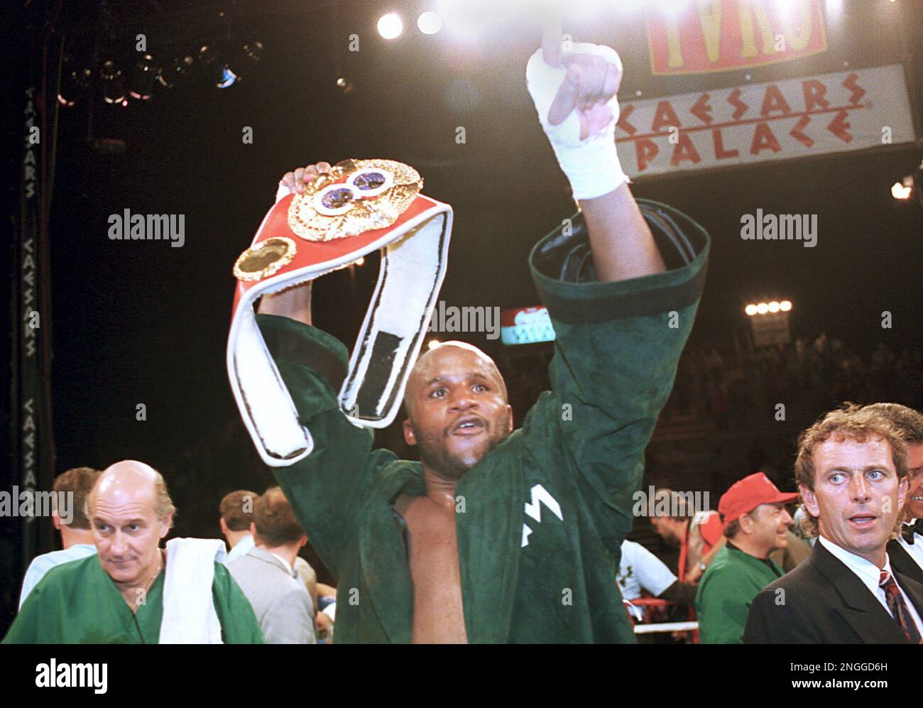 Michael Moorer, new world heavyweight champion, celebrates his win over ...