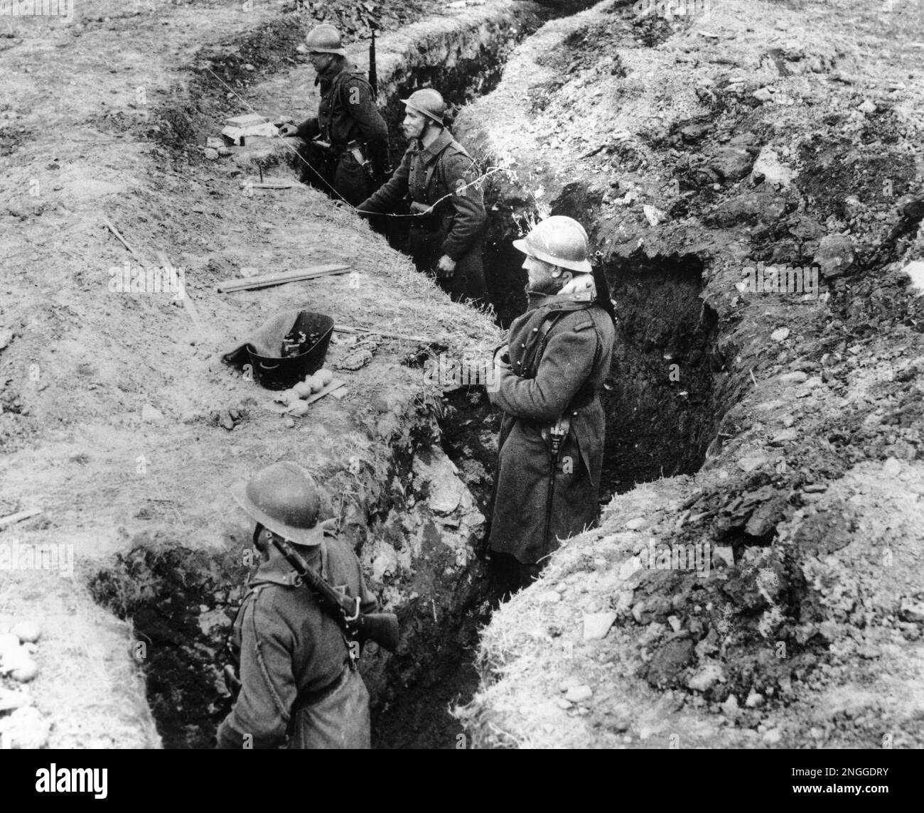 Standing in a trench, these French soldiers are ready to defend ...