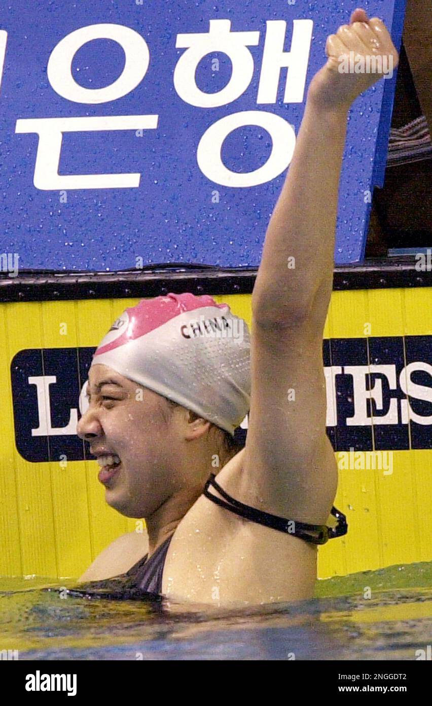 China's Zhan Shu reacts to winning the women's 100m backstroke final ...