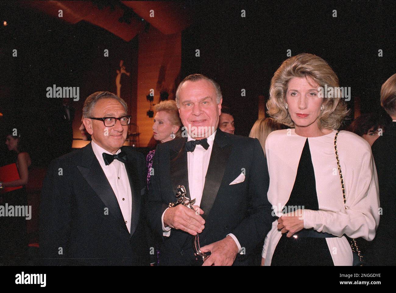 Former Secretary of State Henry Kissinger, left, and his wife, Nancy ...