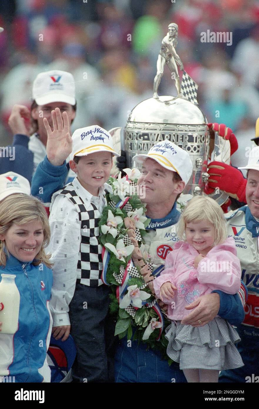 Al Unser Jr. celebrates with his wife, Shelley, left, and children ...