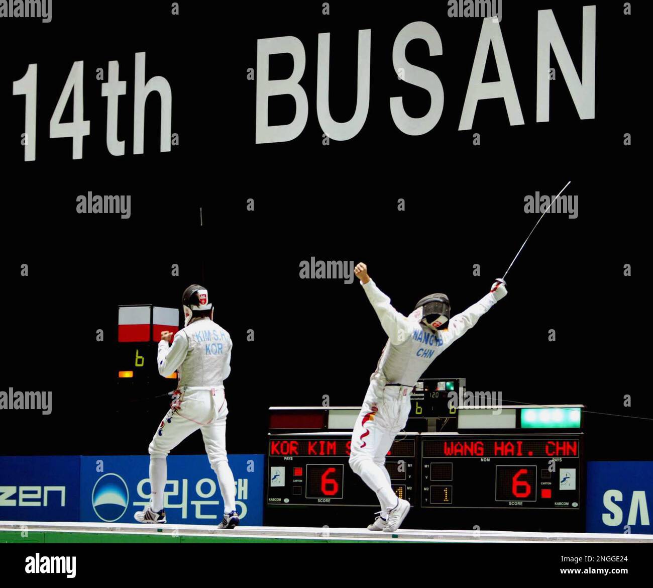 China's Wang Haibin, right, rejoices after scoring a point from South ...