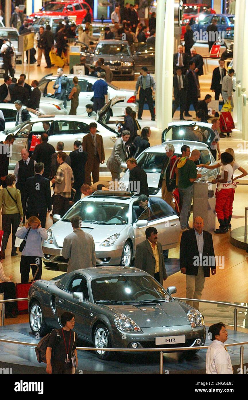 Reporters stroll through cars on the first of two press days at the ...