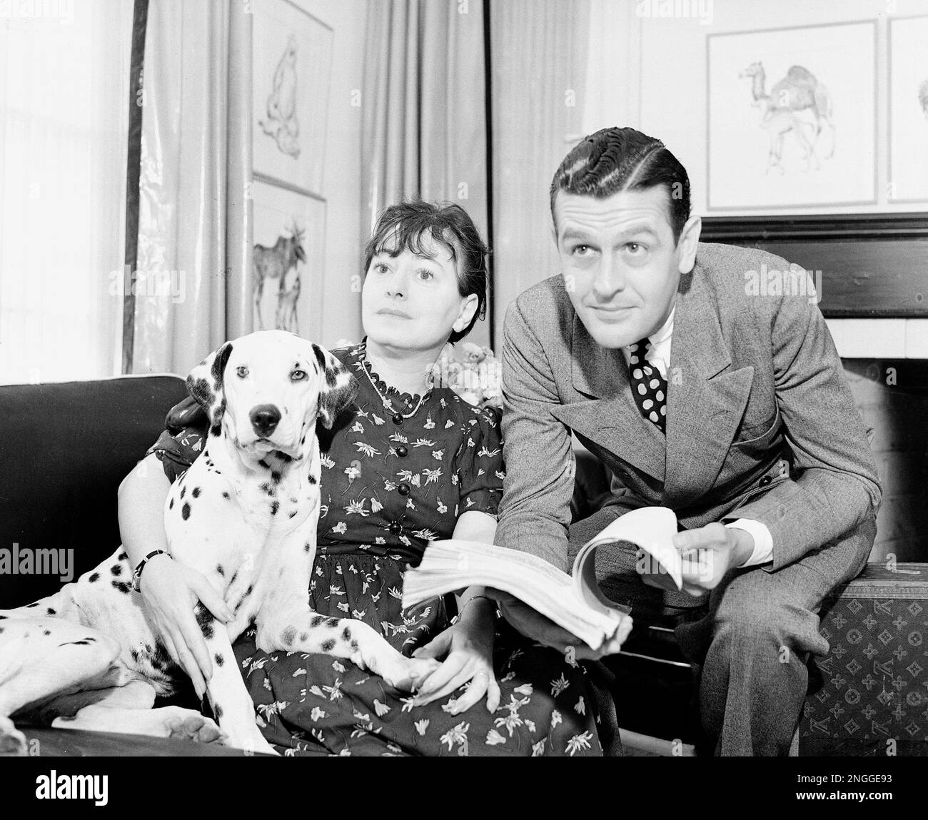 Dorothy Parker and her husband Alan Campbell are shown with their dog ...