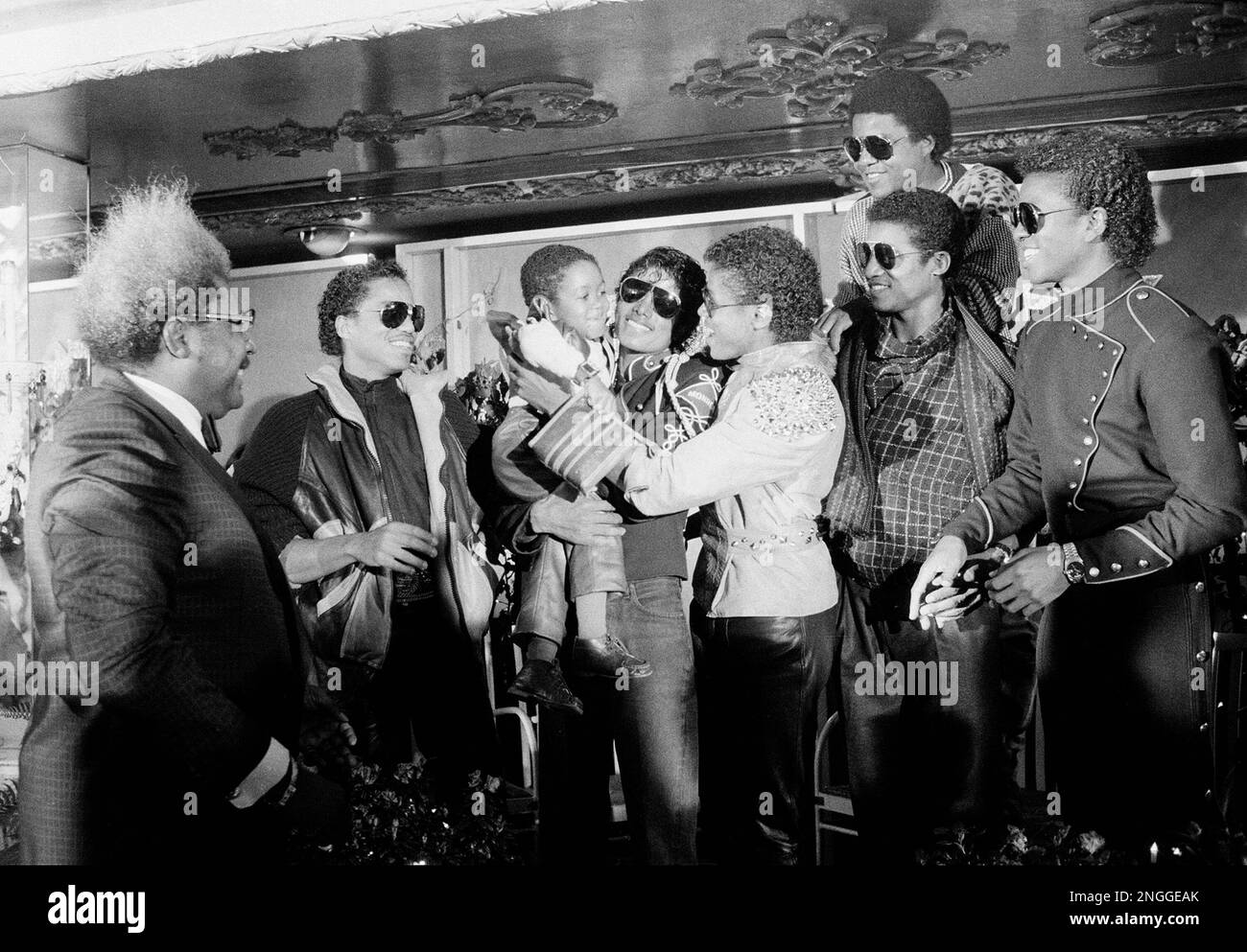 Fight promoter Don King, left, looks on as the Jackson family crowds ...