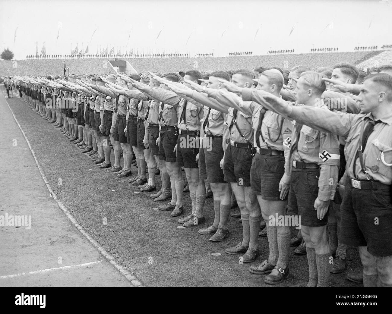 Hitler Youth salute during review by their feuhrer at a mass Nazi rally ...