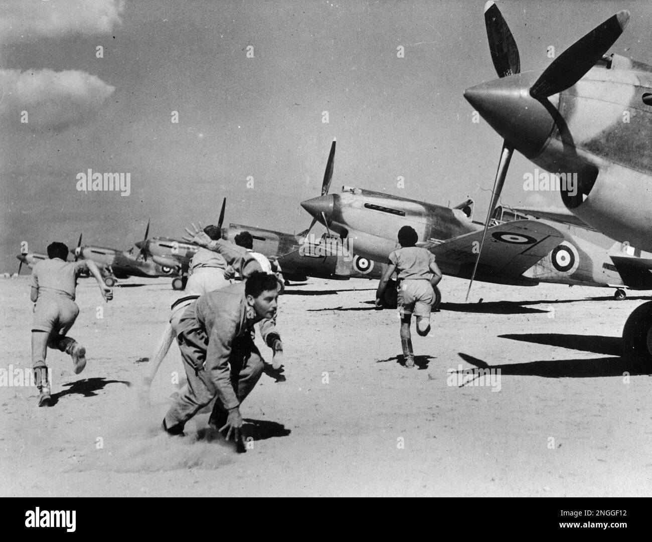 Men of a British RAF fighter squadron are seen at an unknown airfield ...
