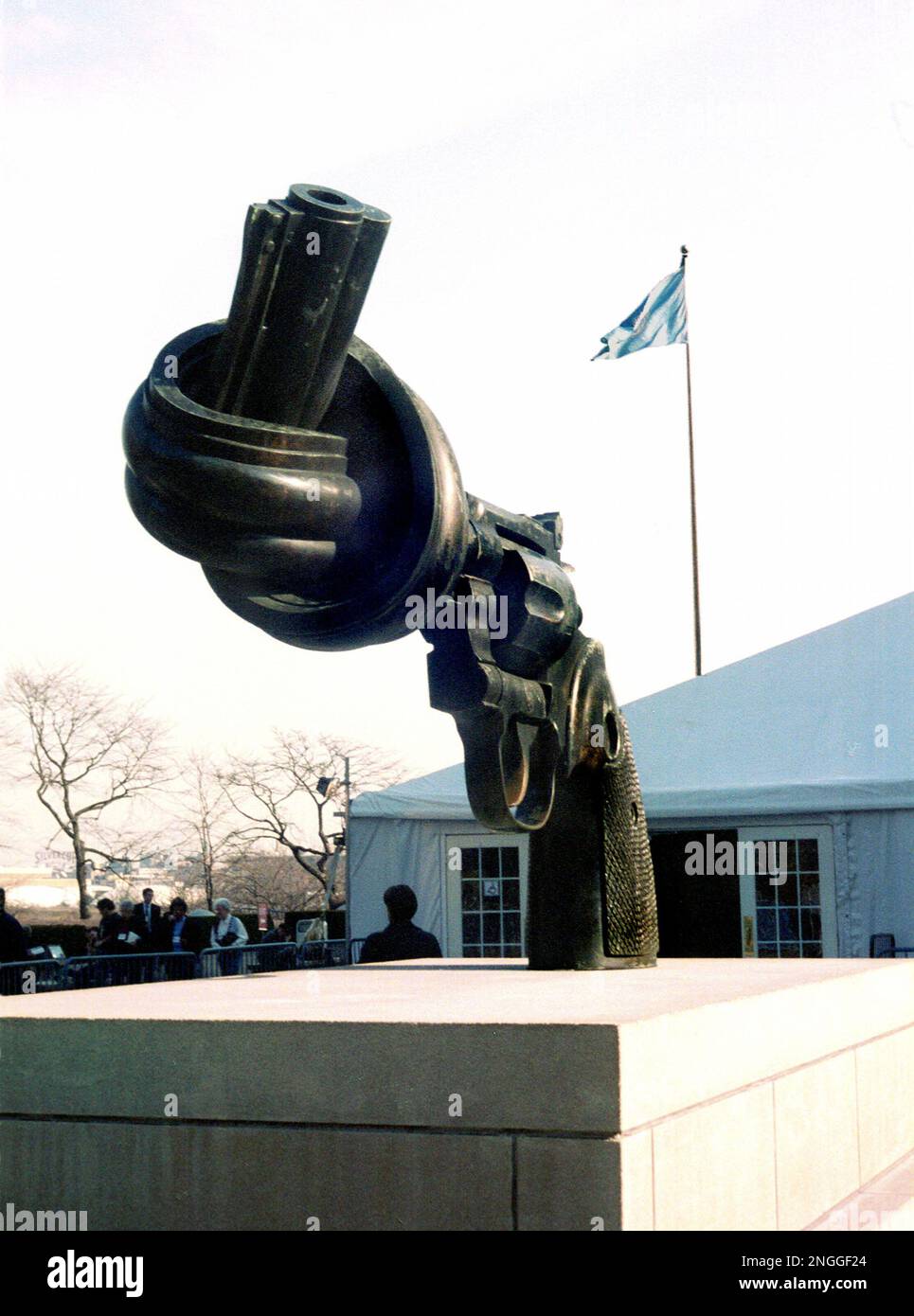 The sculpture of a hand gun with a knotted barrel can be seen in front ...