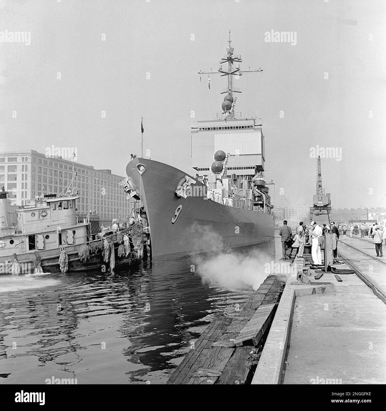 A tug noses the world's first nuclear cruiser USS Long Beach into ...