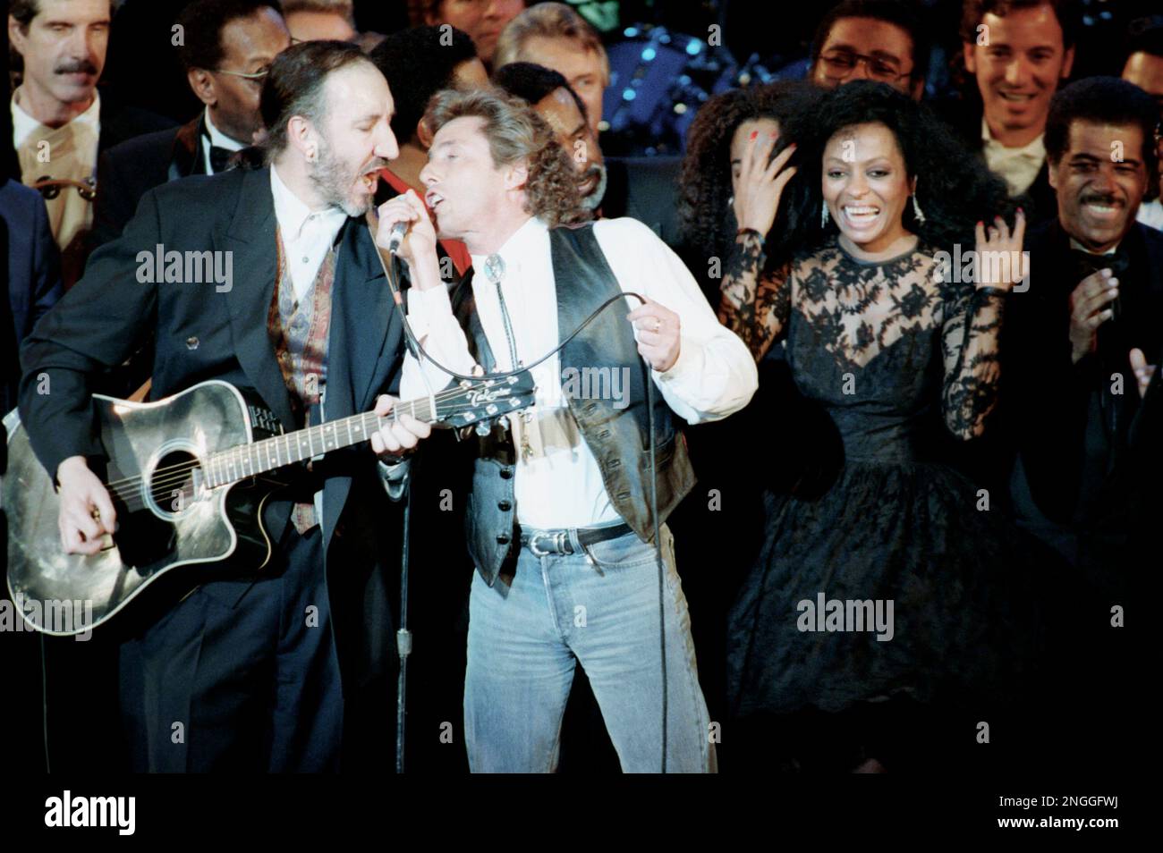 Pete Townsend, playing on guitar, and Roger Daltrey, members of the ...