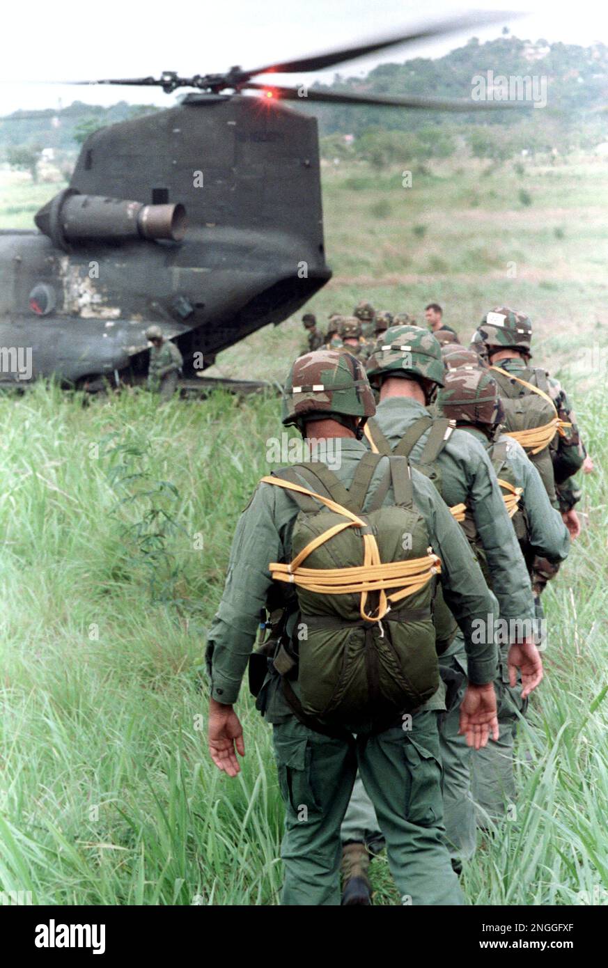 Members of the 1st Battalion Airborne, 508th Infantry division, The Red Devils, prepare to board ...