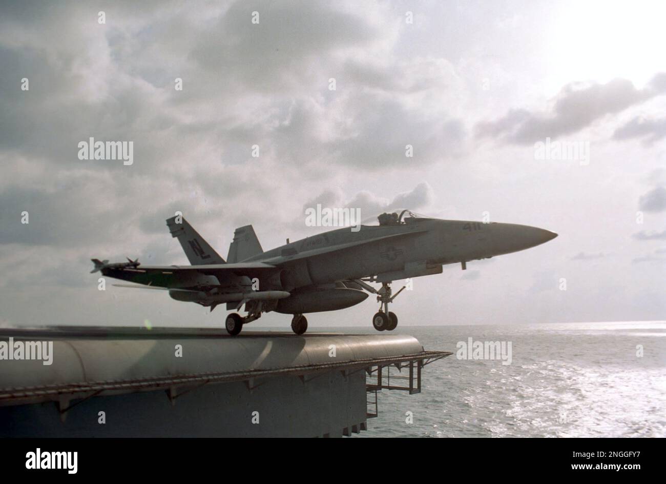 A USAF F/A-18 Hornet is launched from the flight deck of the aircraft ...