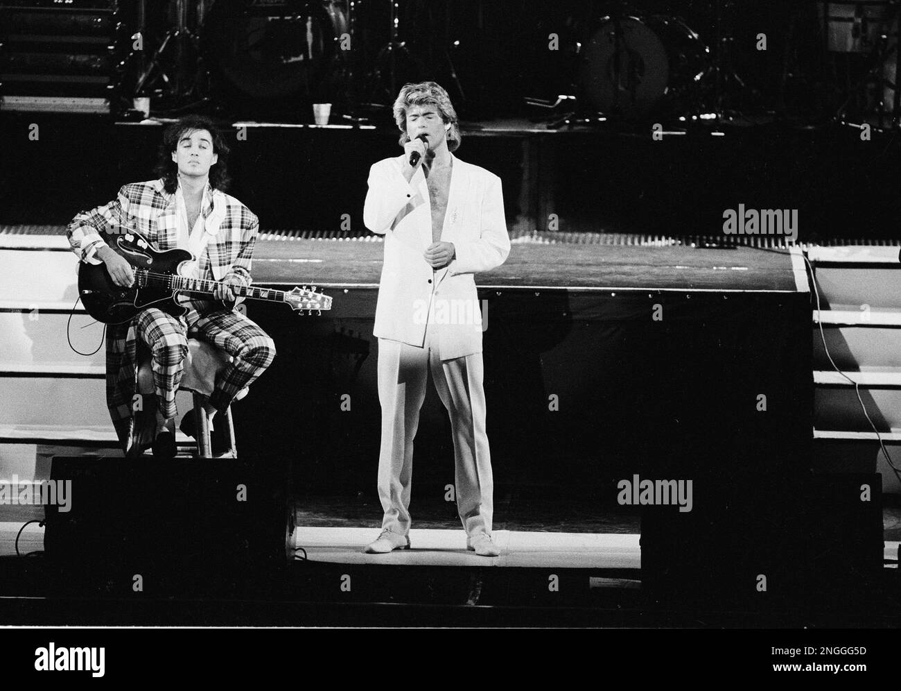The British pop duo Wham!, Andrew Ridgeley on guitar and George Michael ...