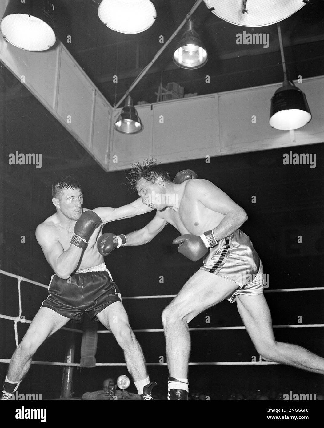European light-heavyweight champion Gerhard Hecht, right, lands a right to the body of Canadian ...