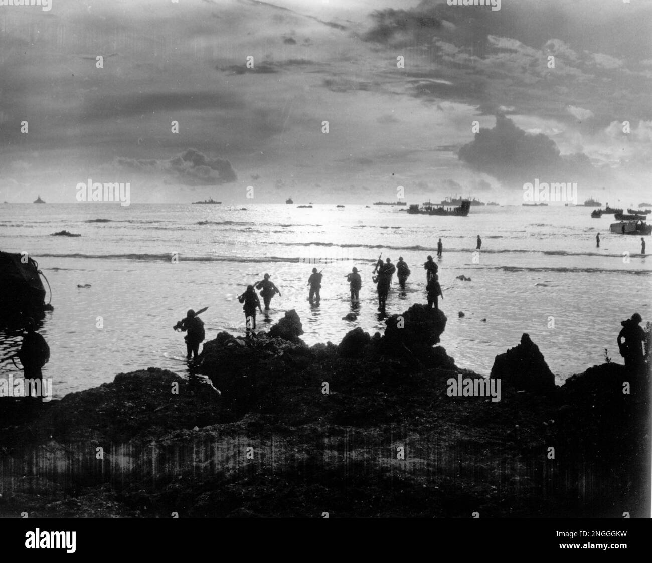 From a Coast Guard-manned landing craft, American soldiers wade ashore ...