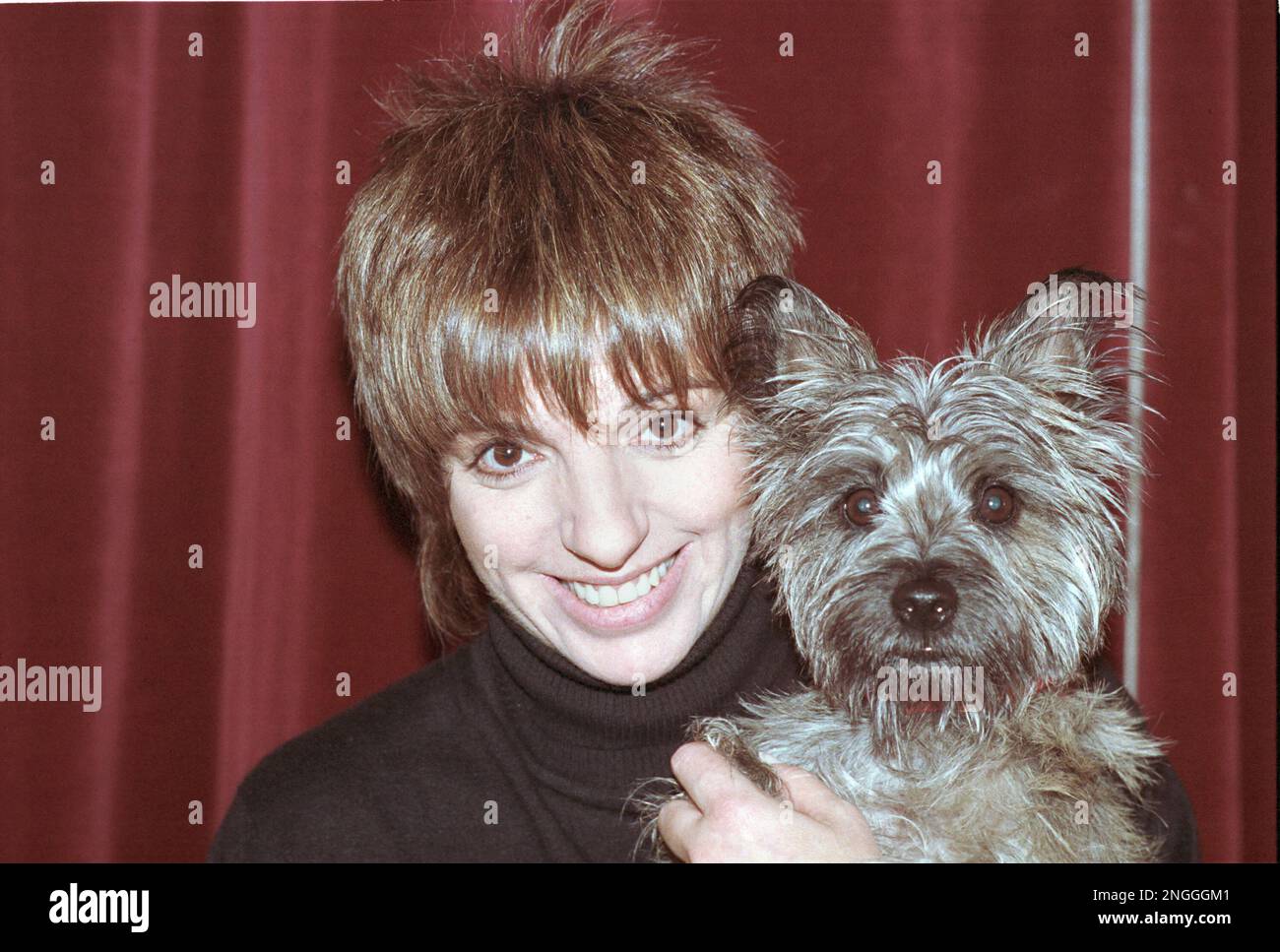 American singer Liza Minnelli poses with her dog Lilly in her dressing ...