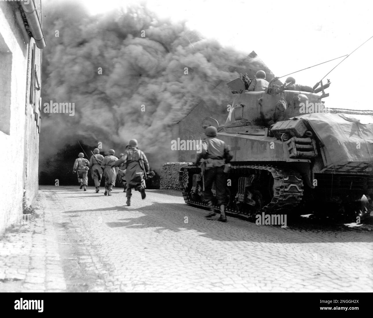 Soldiers of the 55th Armored Infantry Battalion and a tank of the 22nd ...