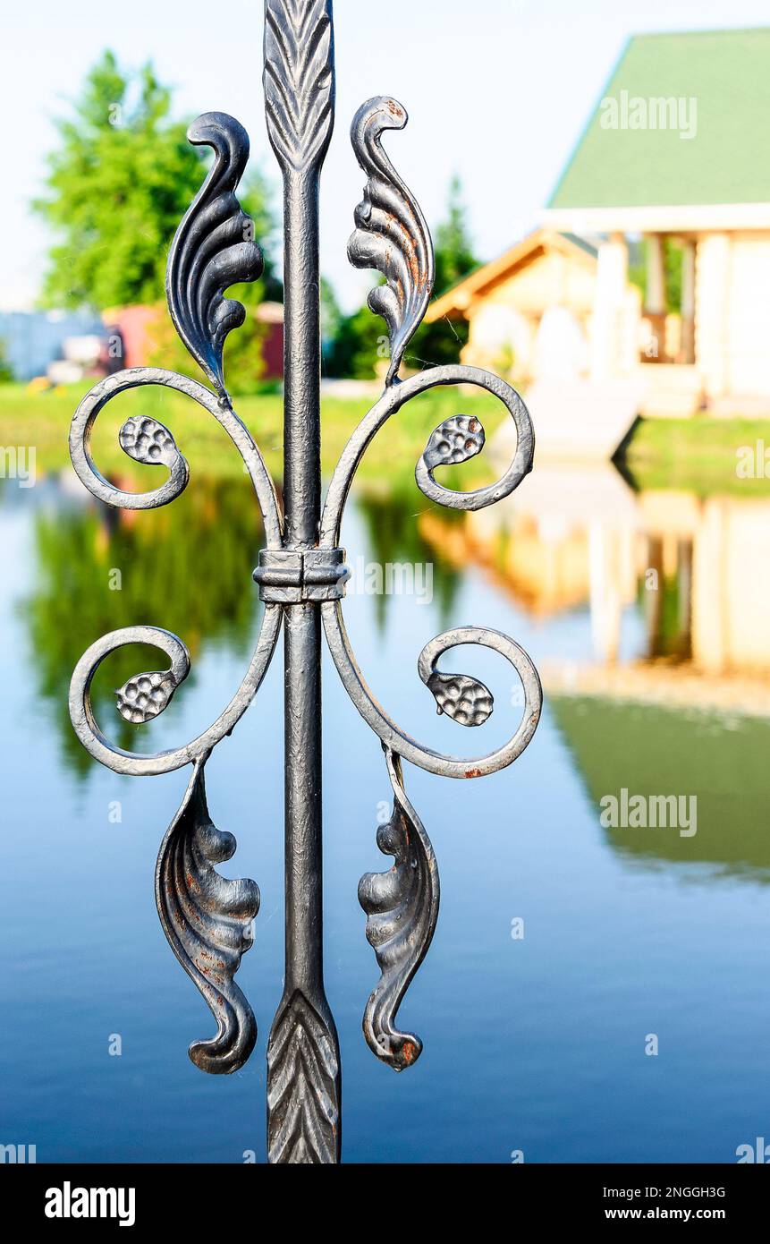 A pattern of metal against the background of a summer cottage made of ...