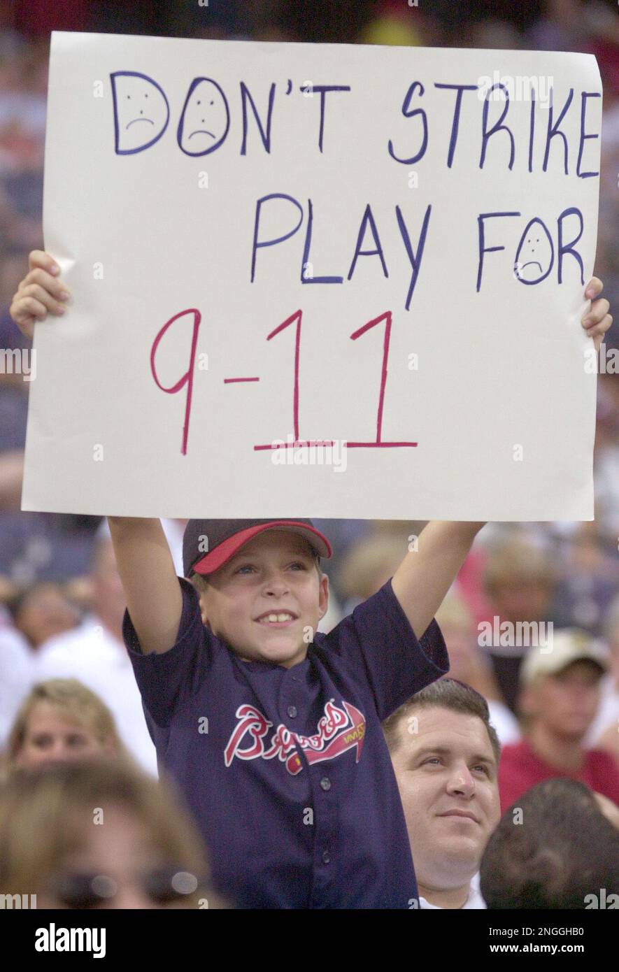 Atlanta Braves fan Stewart Rich, 9, of Macon, Ga., lets the Braves and ...