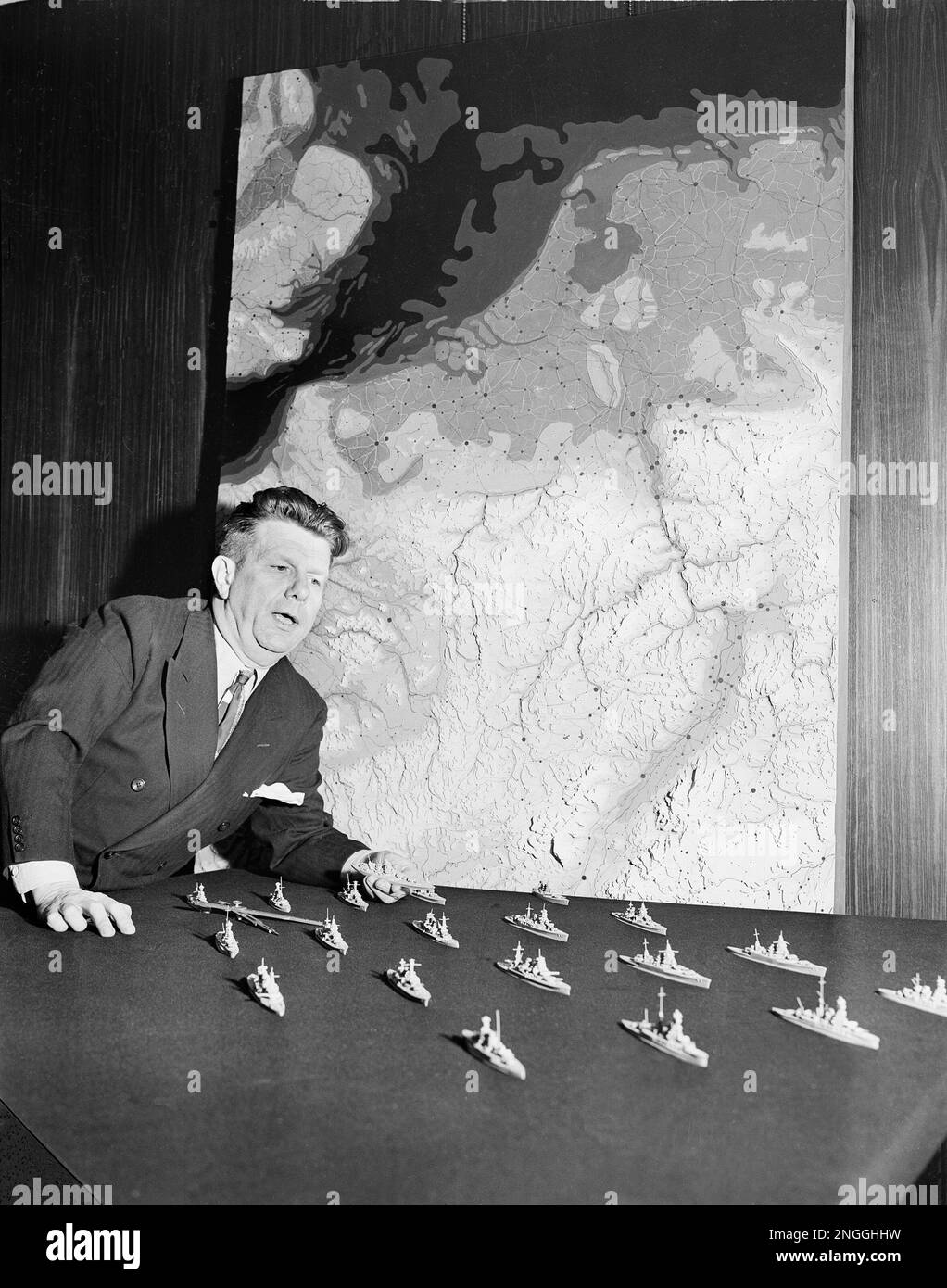 Norman Bel Geddes, architect and industrial designer, is shown with ...