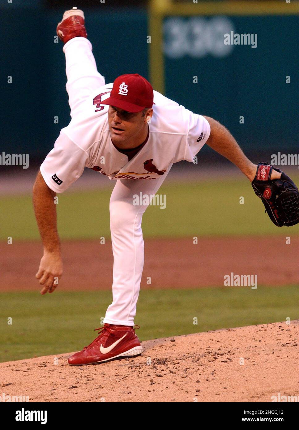 S. Louis Cardinals starting pitcher Andy Benes follows through on his ...