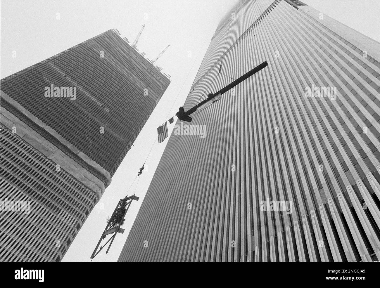 The American flag, attached to a 36-foot-long, four-ton steel column ...