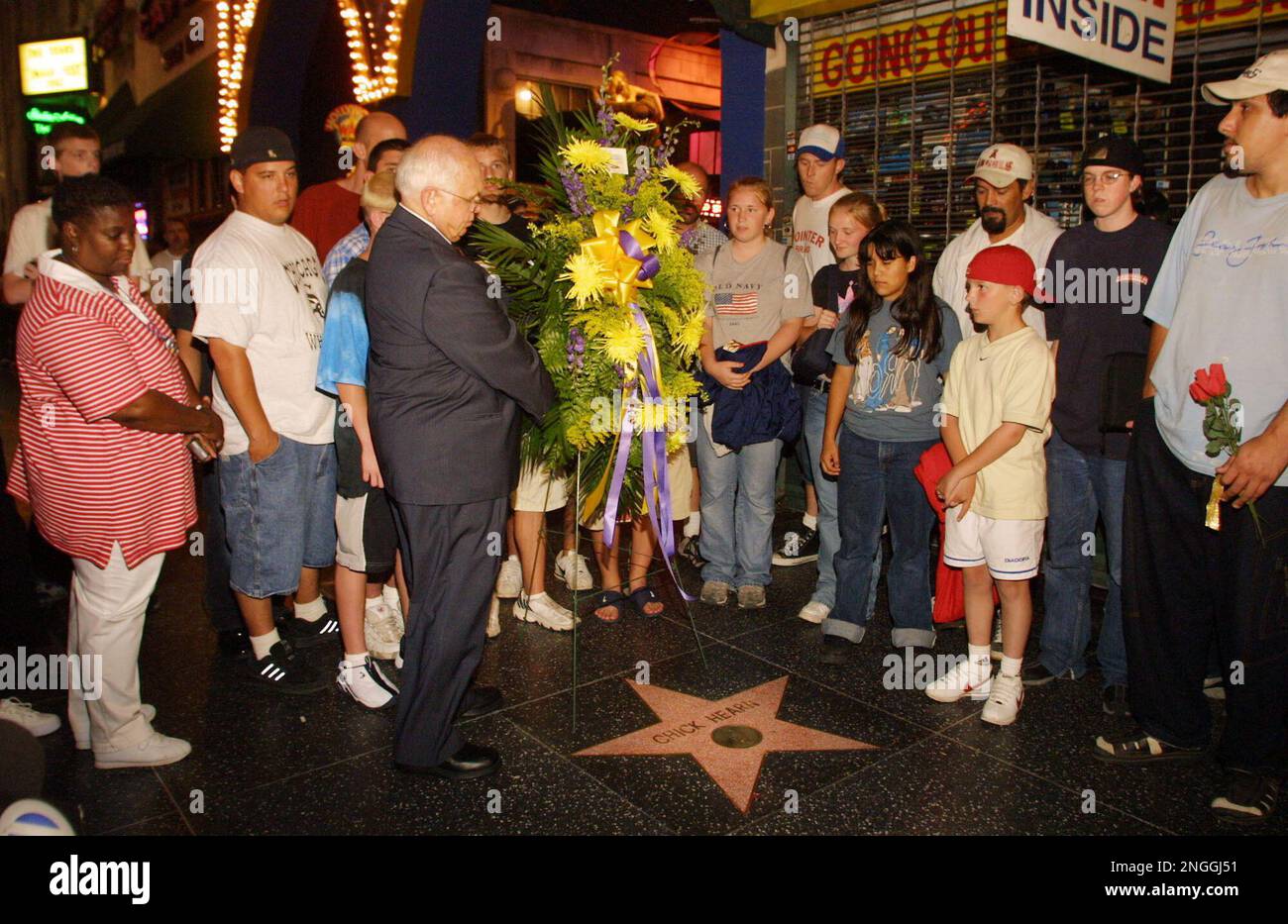 Honorary mayor of Hollywood Johnny Grant places a wreath of flowers on ...