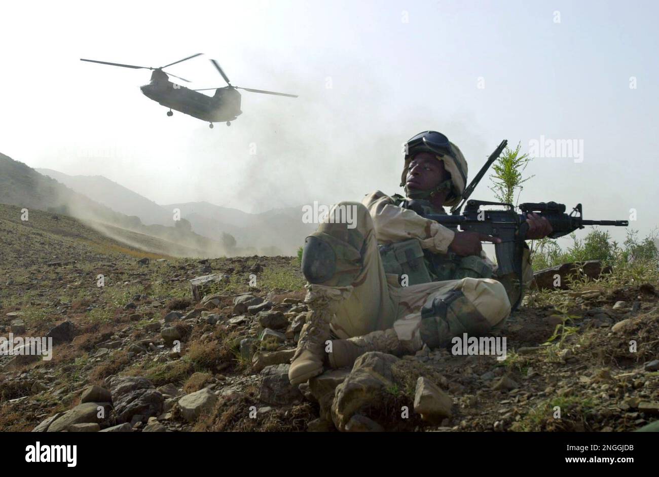 A U.S. soldier of the 82nd Airborne Division secures the perimeter as a ...