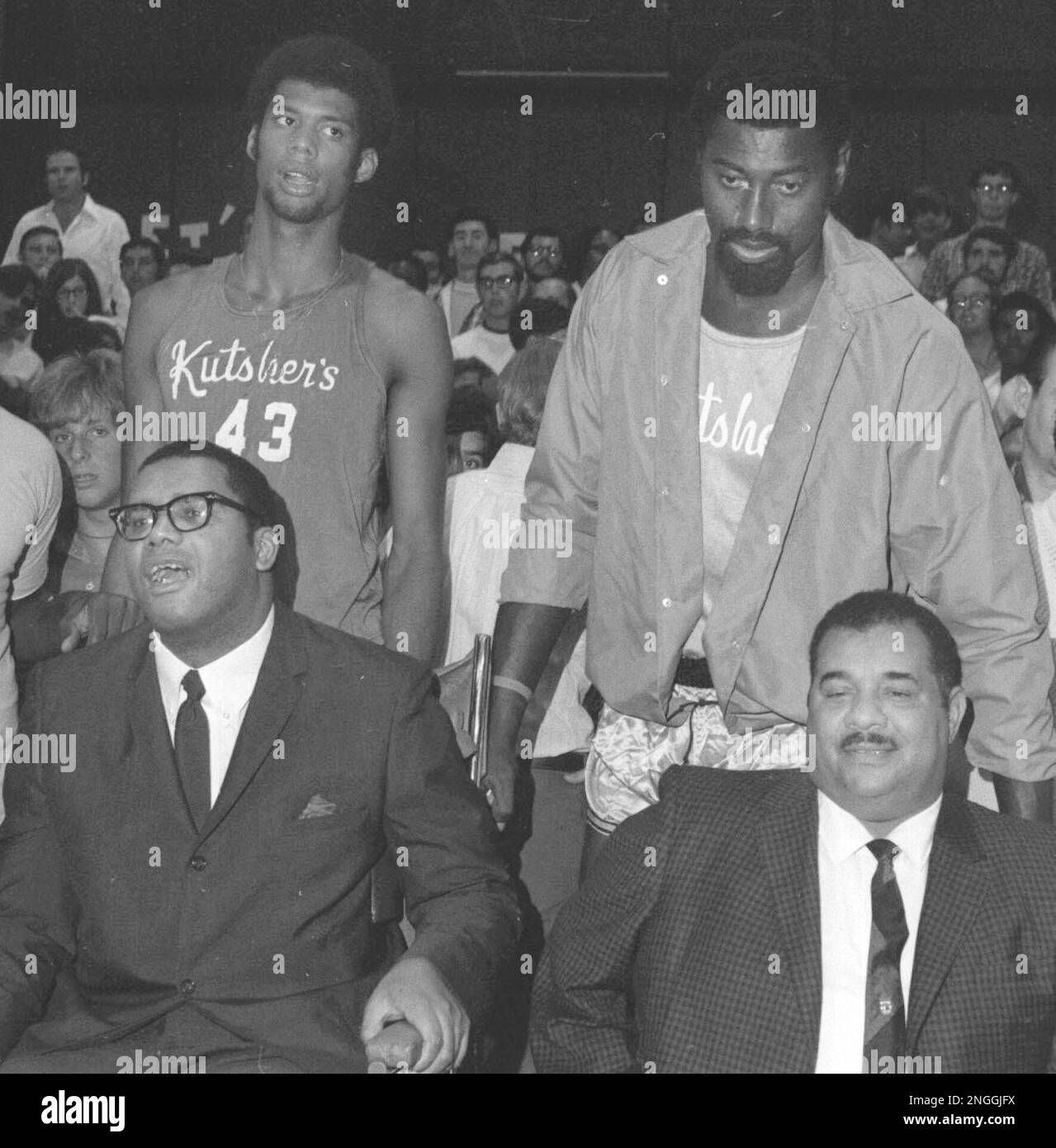 Basketball greats Lew Alcindor, standing at left, and Wilt Chamberlain ...
