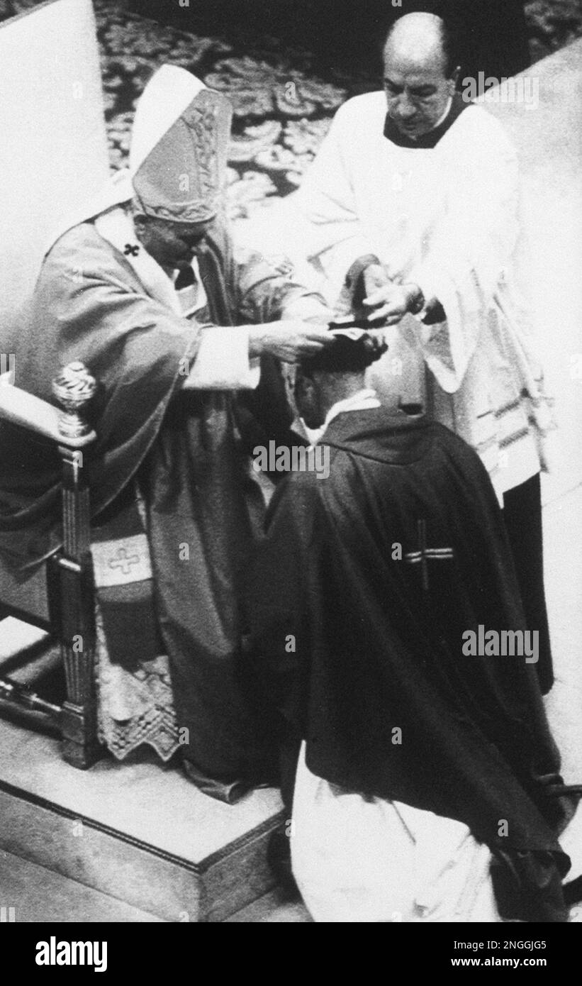 Pope John Paul II places the Pallium around the neck of Archbishop ...