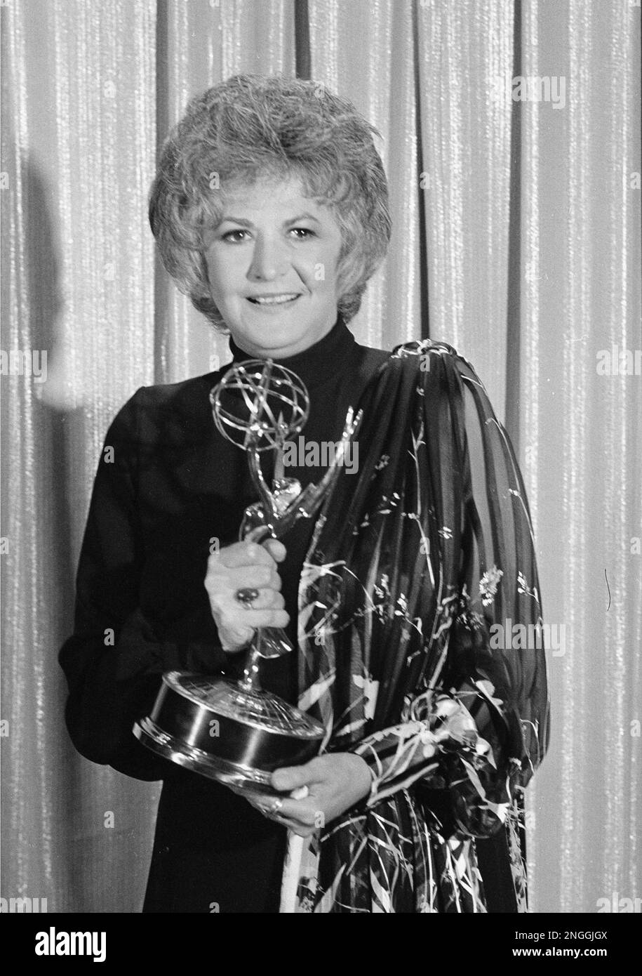 Actress Beatrice Arthur poses with her Emmy Award for best actress in a ...