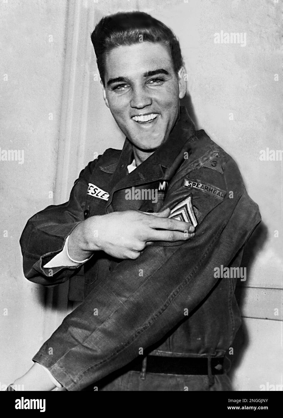 American rock and roll singer Elvis Presley smiles after he is promoted ...