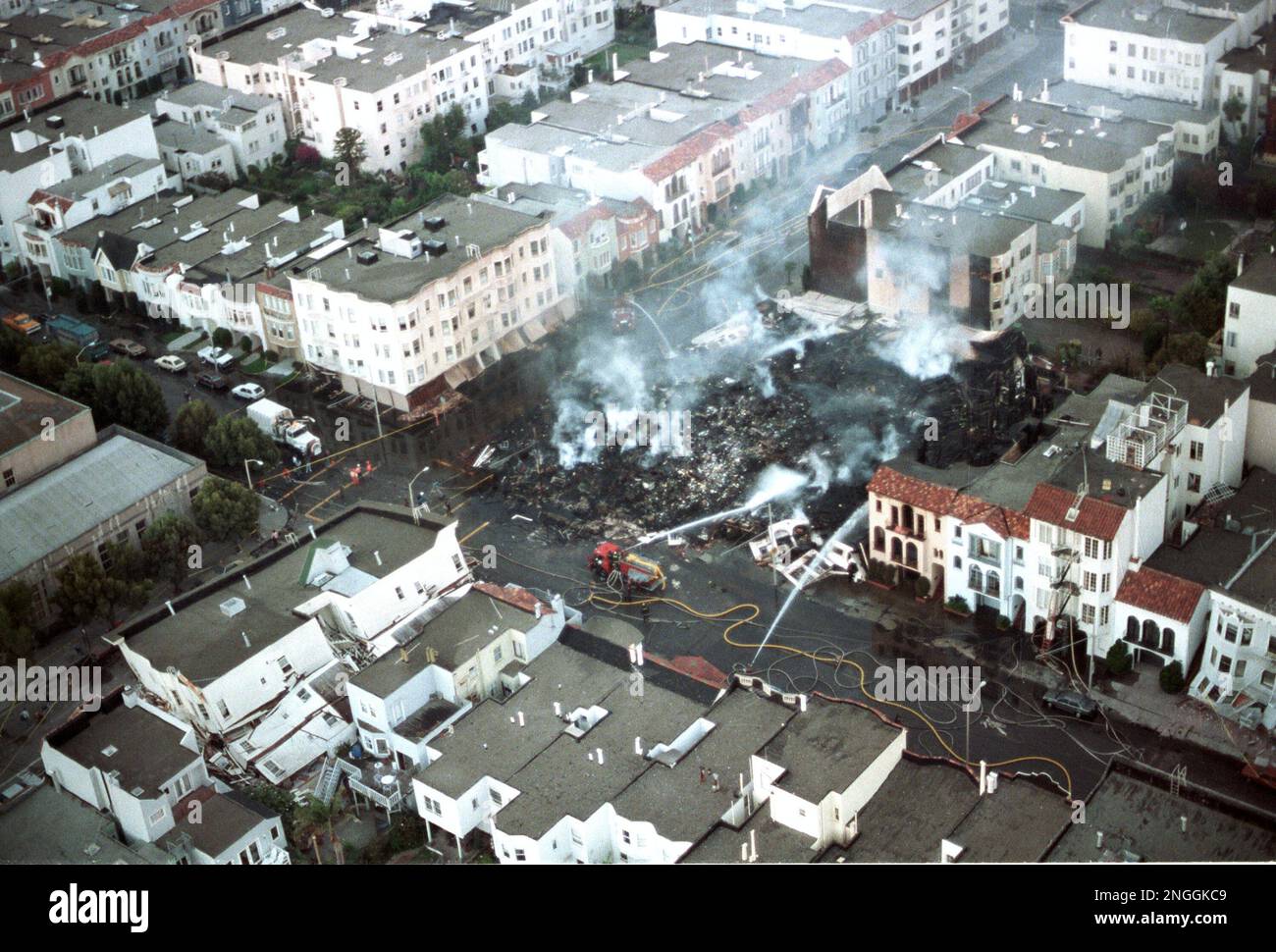 Firefighters continue to put out fires as some buildings smoulder while ...