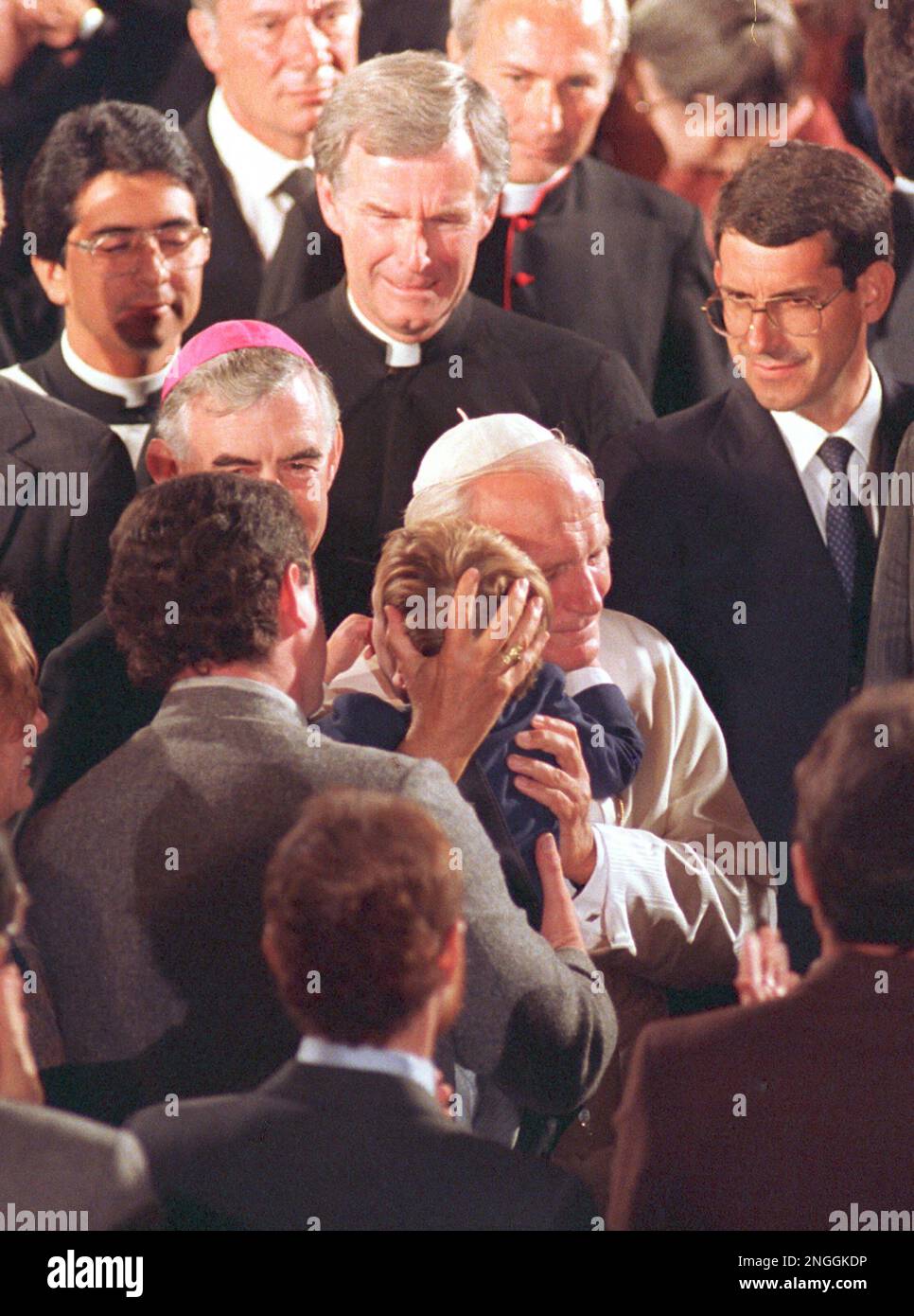 Pope John Paul II embraces five-year-old AIDS victim Brendan O'Rourke ...