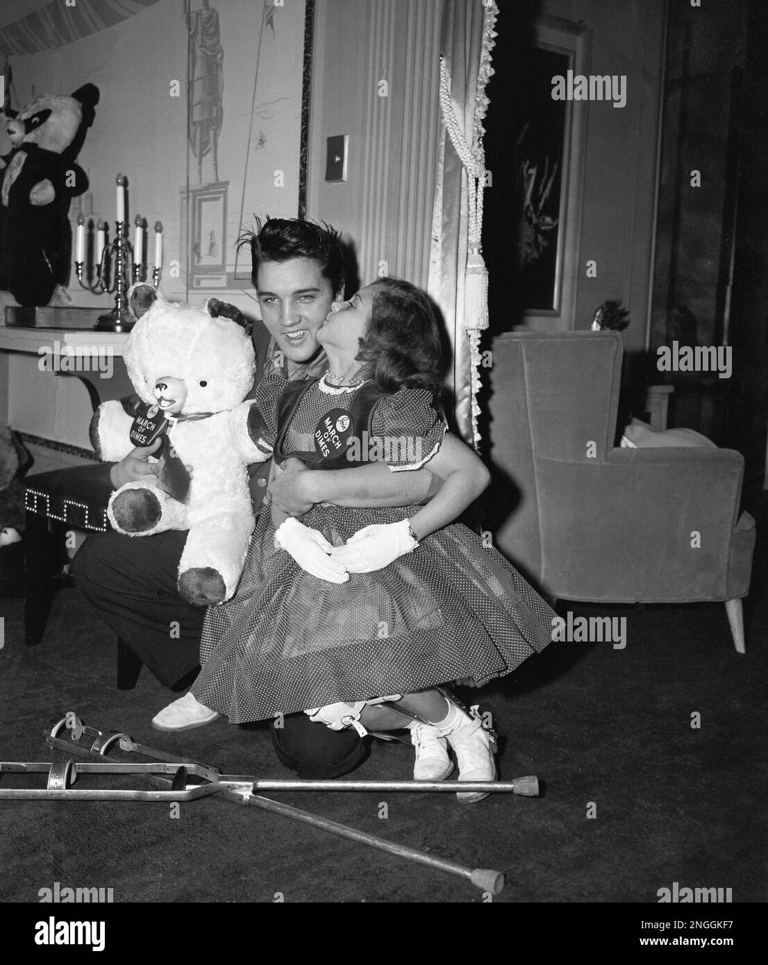 Singer Elvis Presley gets a kiss from eight-year-old Mary Kosloski at ...