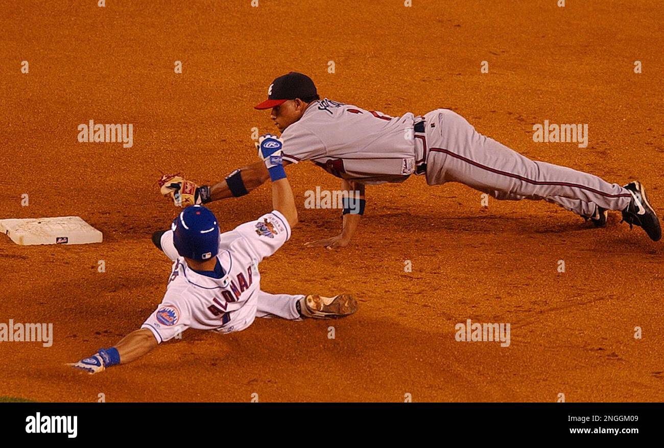 Atlanta Braves Rafael Furcal dives to get New York Mets Roberto Alomar ...