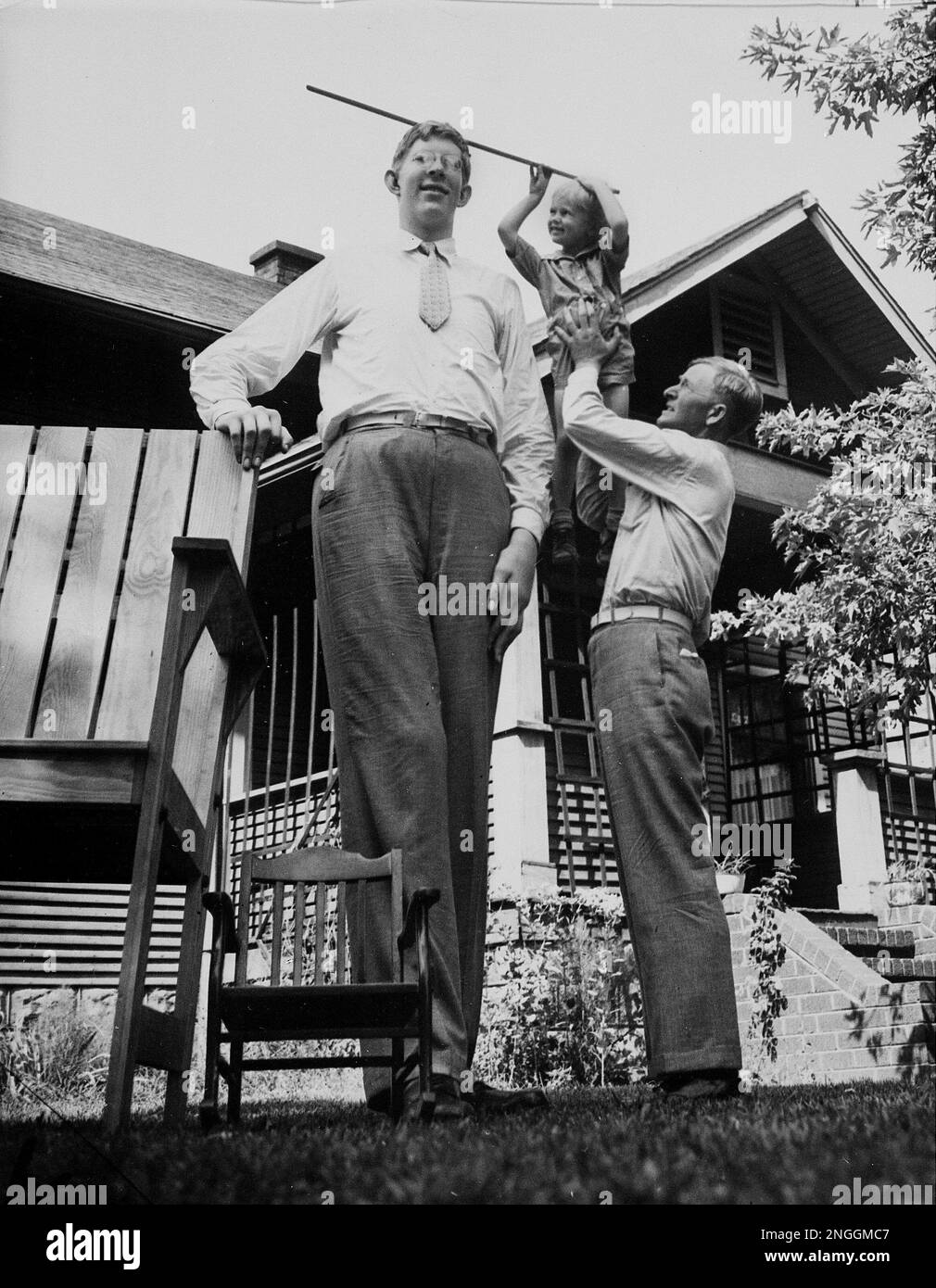 Harold Wadlow, right, lifts his four-year-old son, Harold Jr., who ...