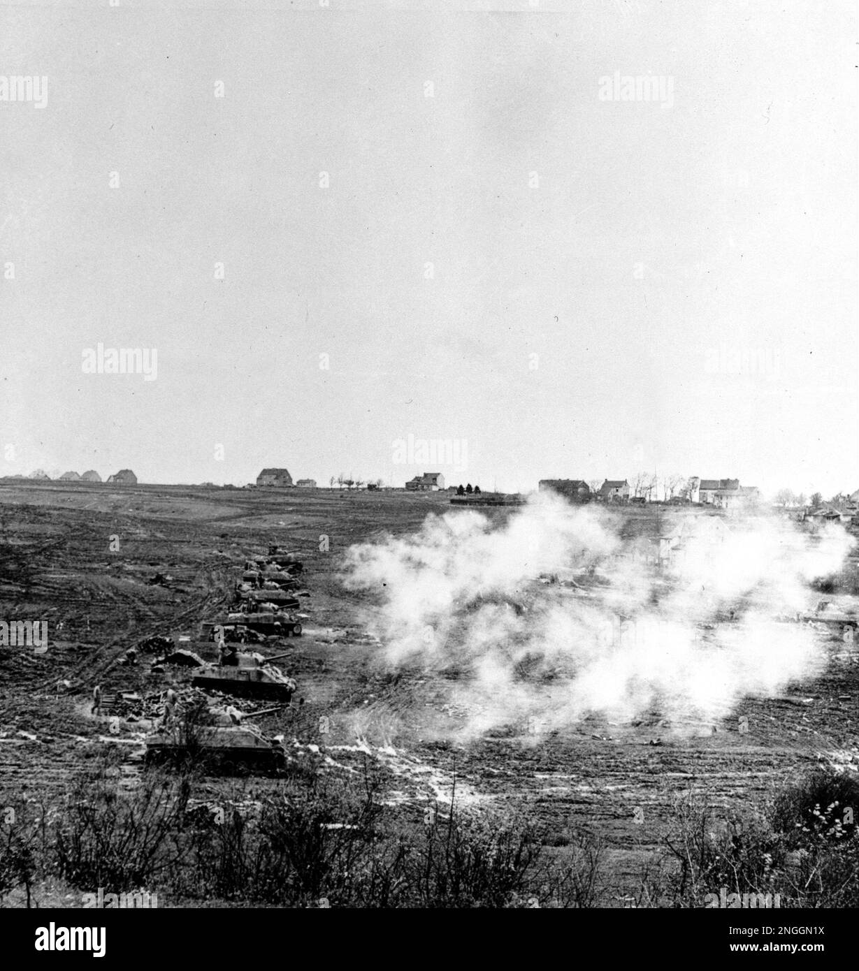 American tanks throw shells at an unidentified target somewhere on the ...
