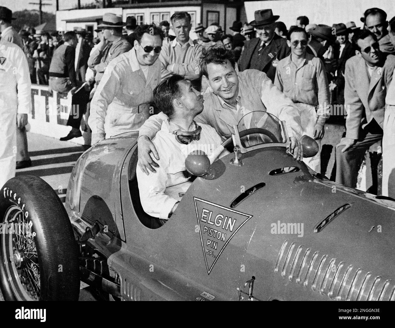 Mauri Rose, an airplane engine plant employee, pretends to kiss his ...