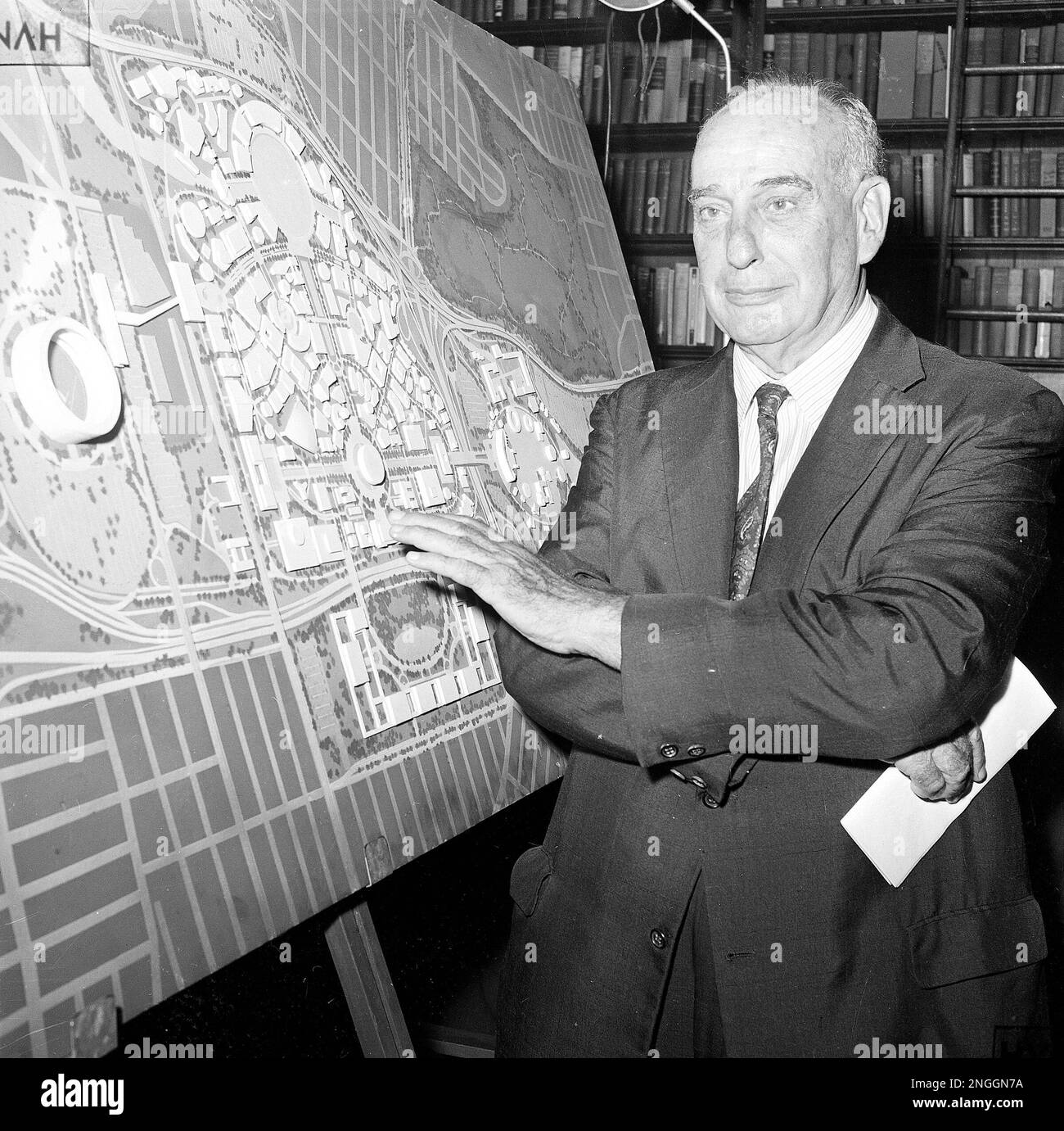 Robert Moses, the man behind the New York World's Fair, poses next to a ...
